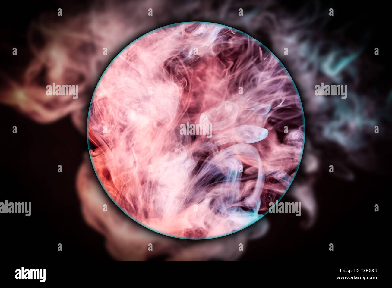 Close-up blue and red bomb smoke blown under a magnifying glass on ...