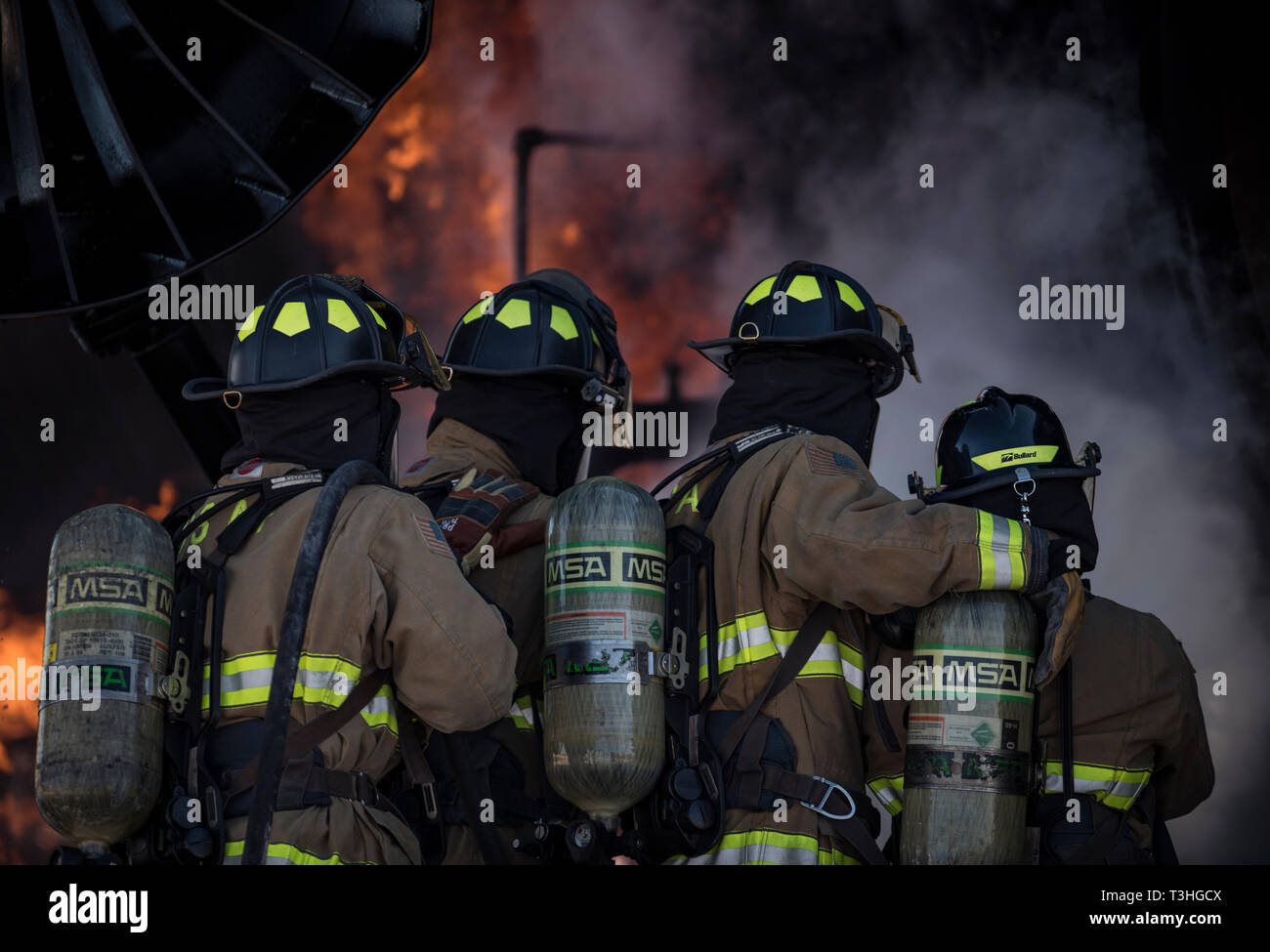 Airmen assigned to the 99th Civil Engineer Squadron battle a simulated ...