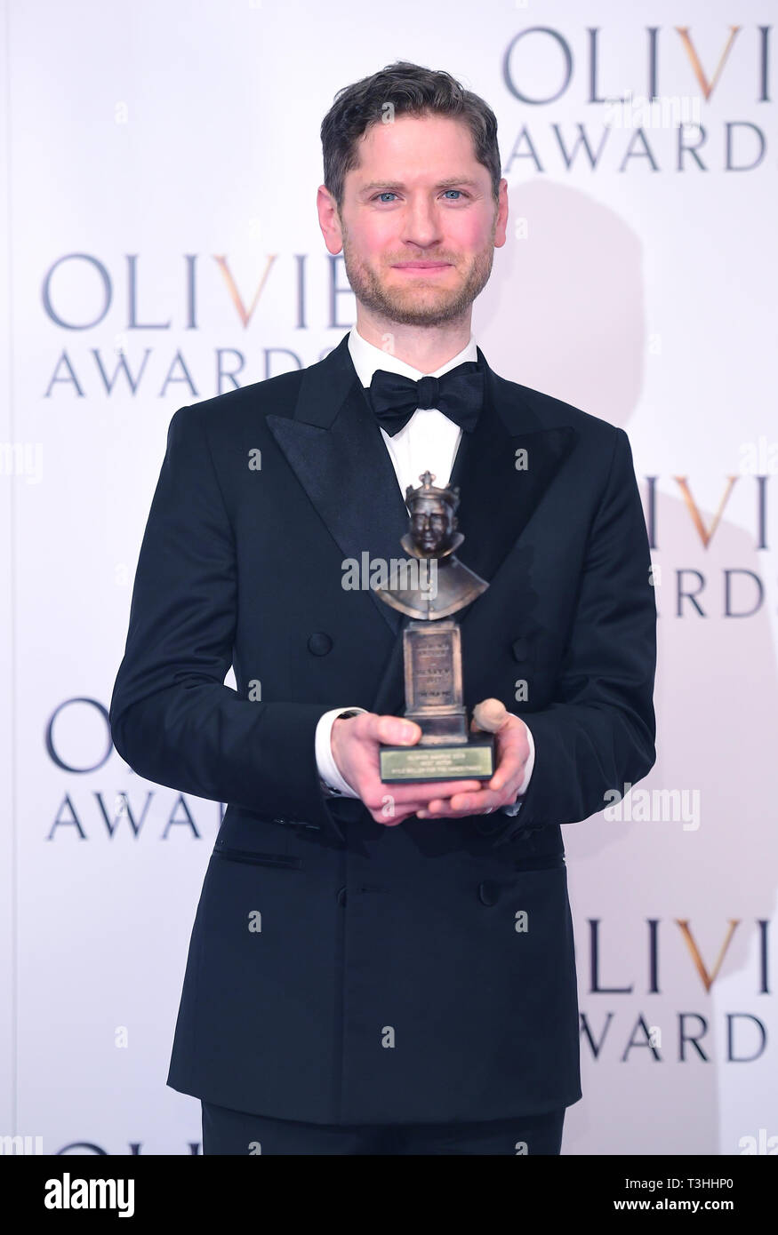 Kyle Soller with the Best actor award, in The Inheritance, presented by ...