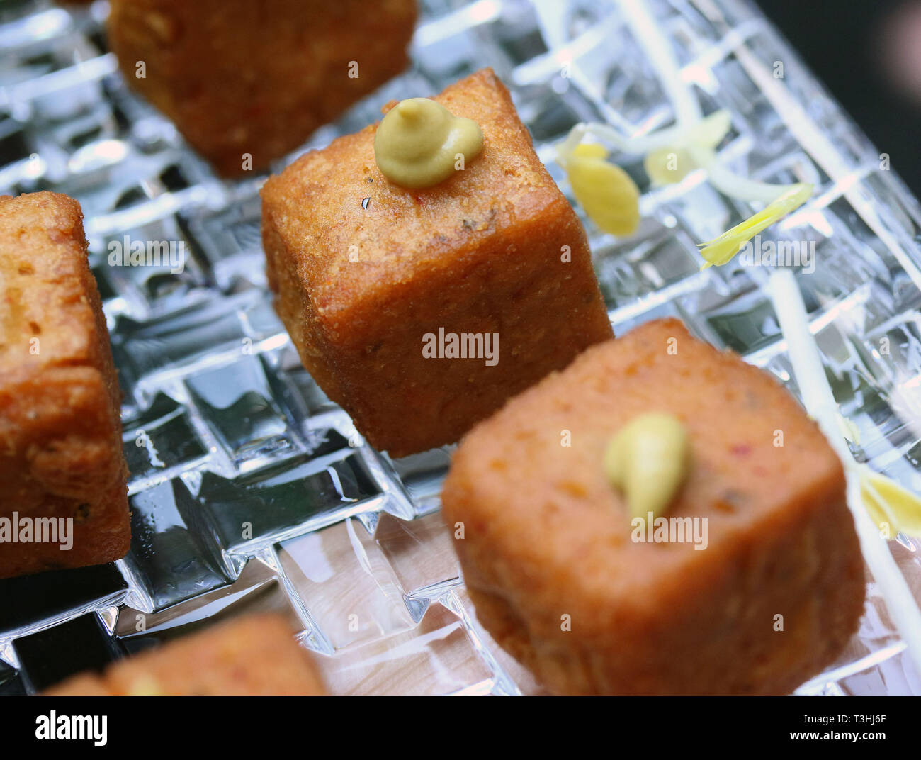 Chickpea appetizers with a mustard drop on crystal glass dish Stock ...