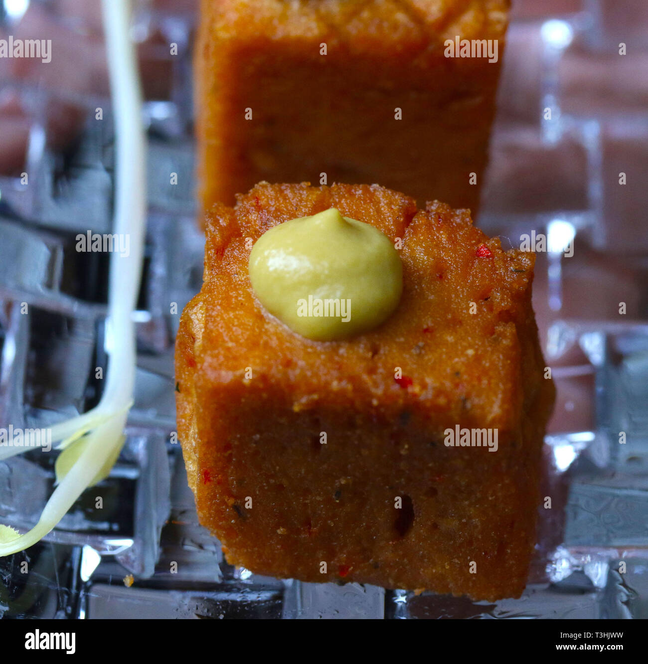 Chickpea appetizers with a mustard drop on crystal glass dish Stock ...