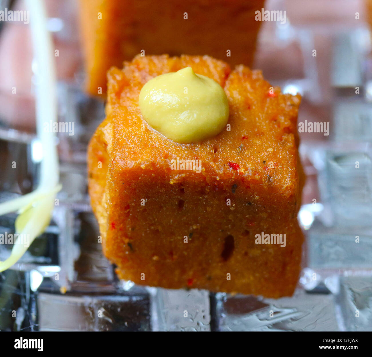 Chickpea appetizers with a mustard drop on crystal glass dish hi-res ...