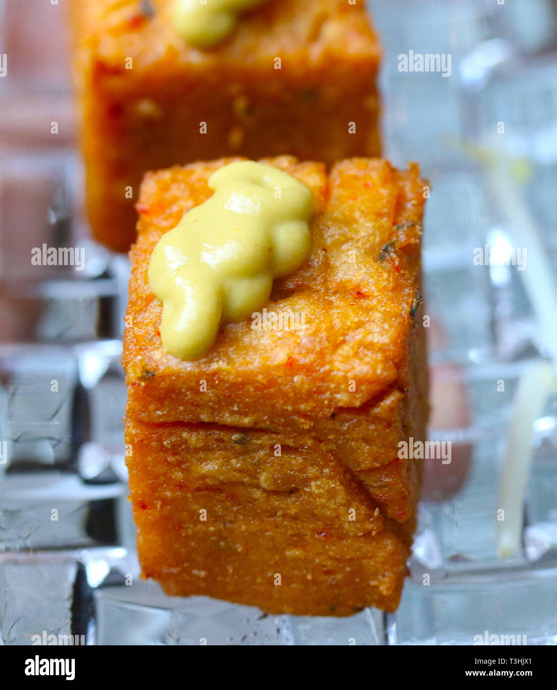 Chickpea appetizers with a mustard drop on crystal glass dish Stock ...