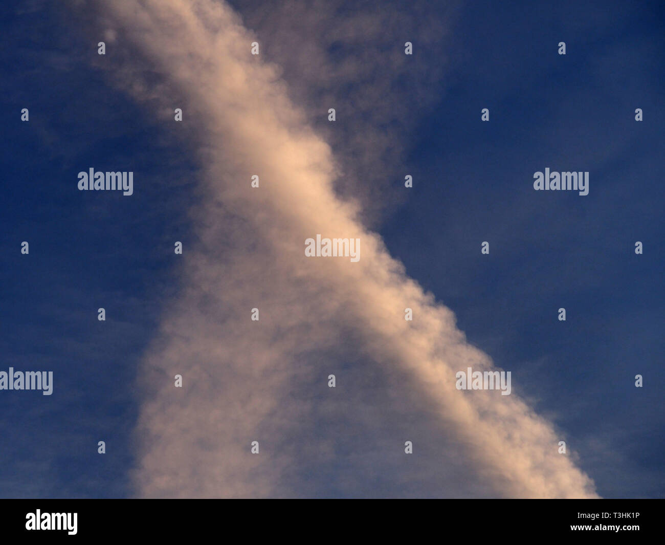 Contrails from a jet plane in the sky. Drawing from the clouds Stock ...
