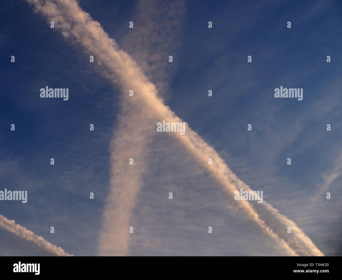 Contrails from a jet plane in the sky. Drawing from the clouds Stock ...
