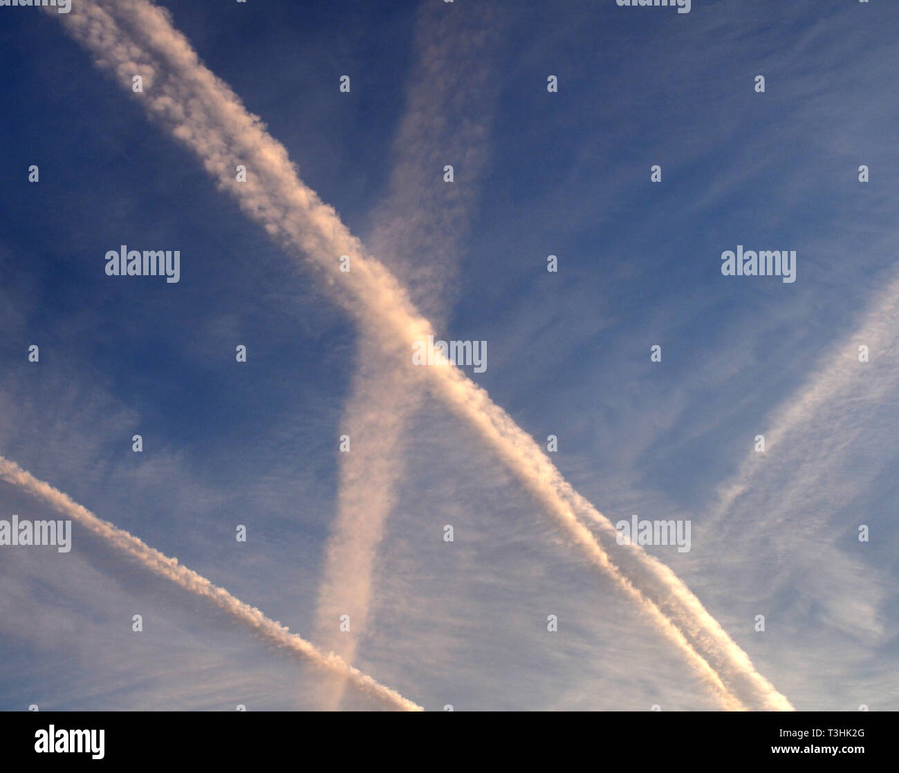 Contrails from a jet plane in the sky. Drawing from the clouds Stock ...
