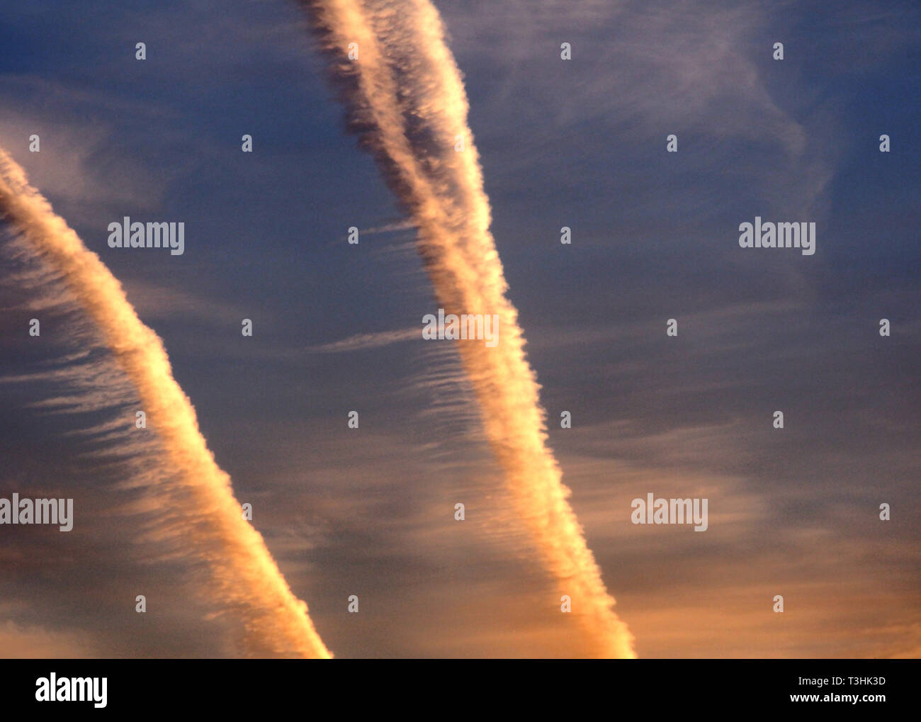 Contrails from a jet plane in the sky. Drawing from the clouds Stock ...