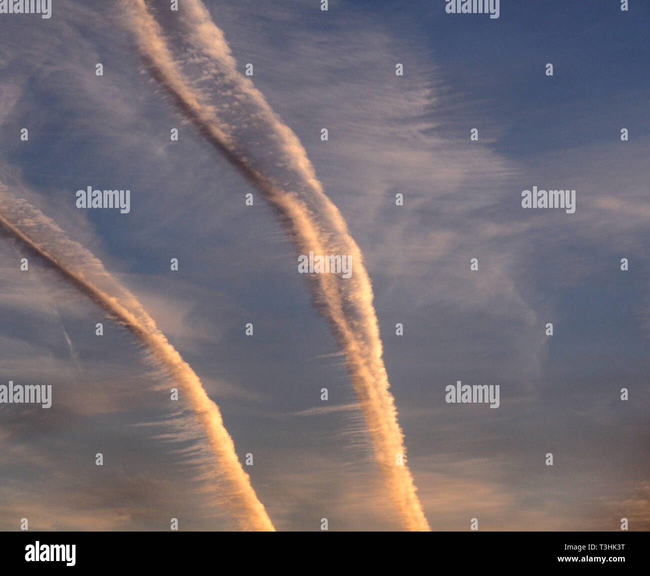 Contrails from a jet plane in the sky. Drawing from the clouds Stock ...