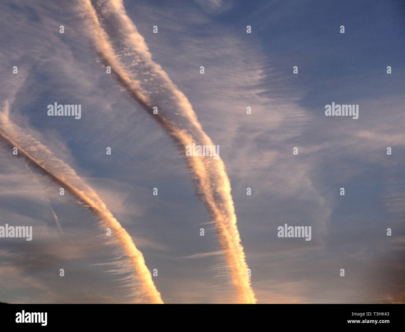 Contrails from a jet plane in the sky. Drawing from the clouds Stock ...