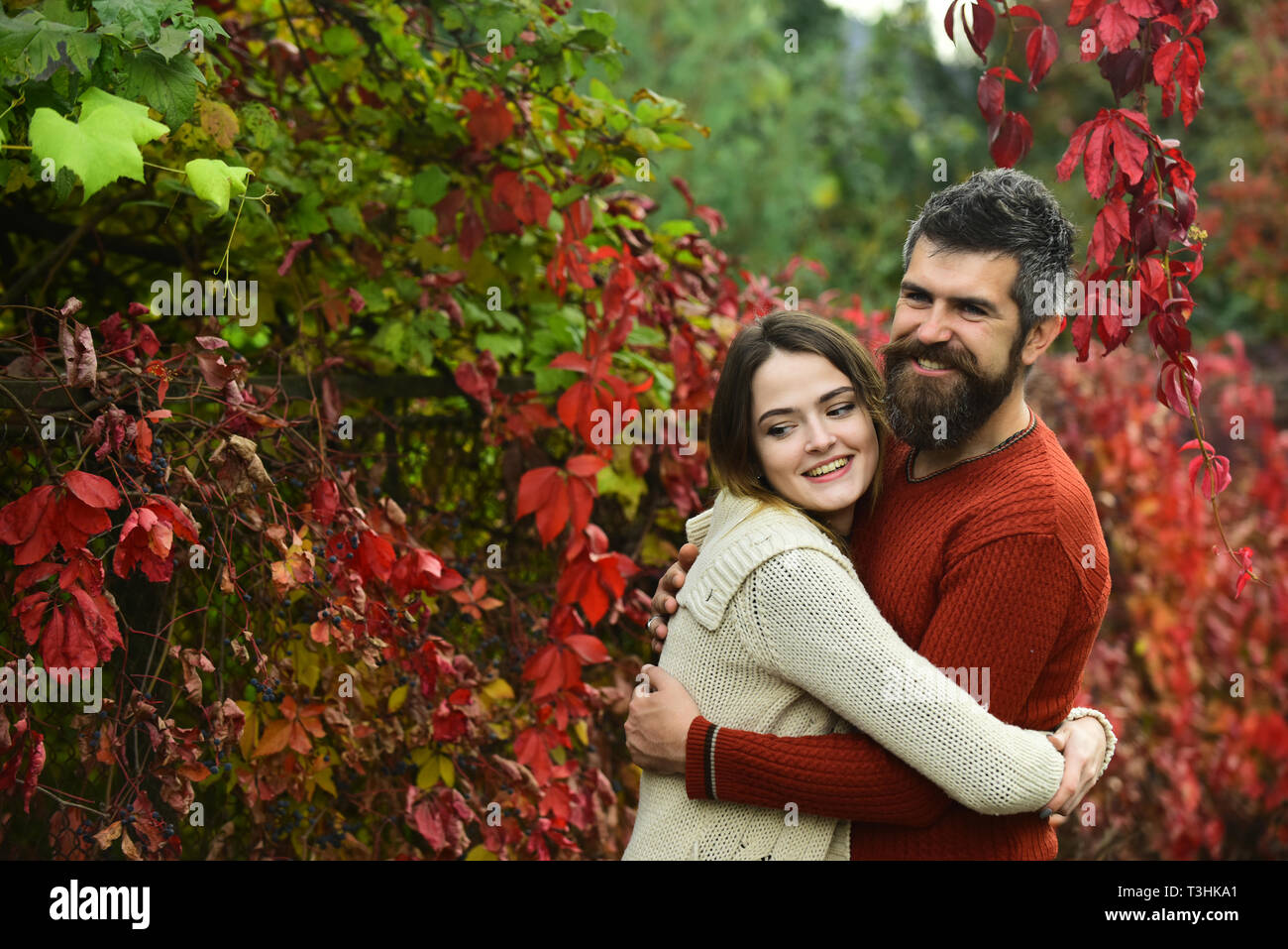 Couple with smiling faces cuddle each other with tenderness Stock Photo ...