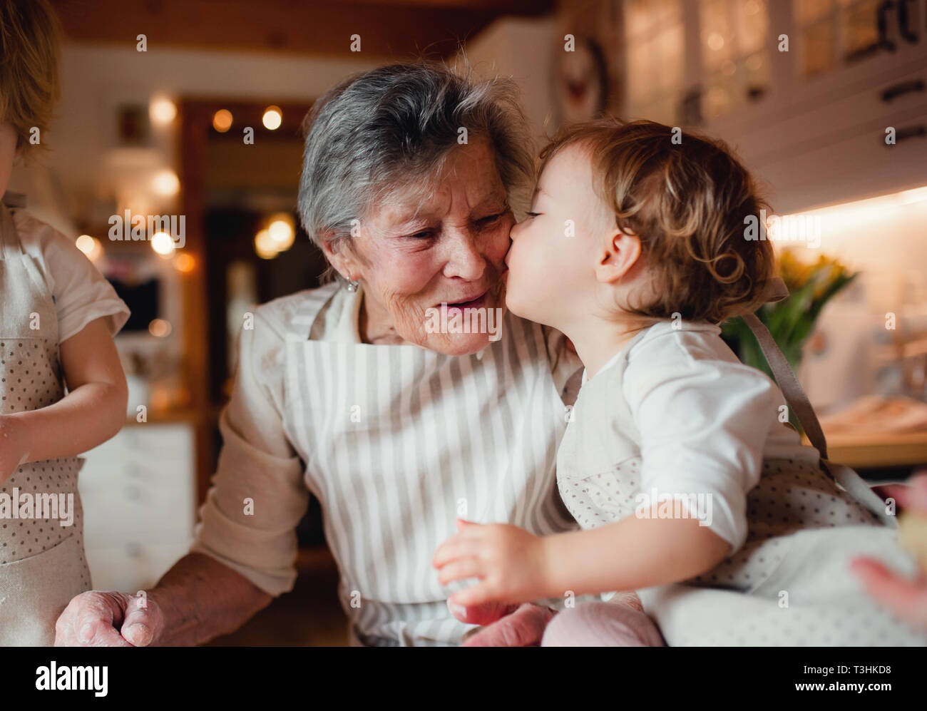 Children helping elderly hi-res stock photography and images - Alamy