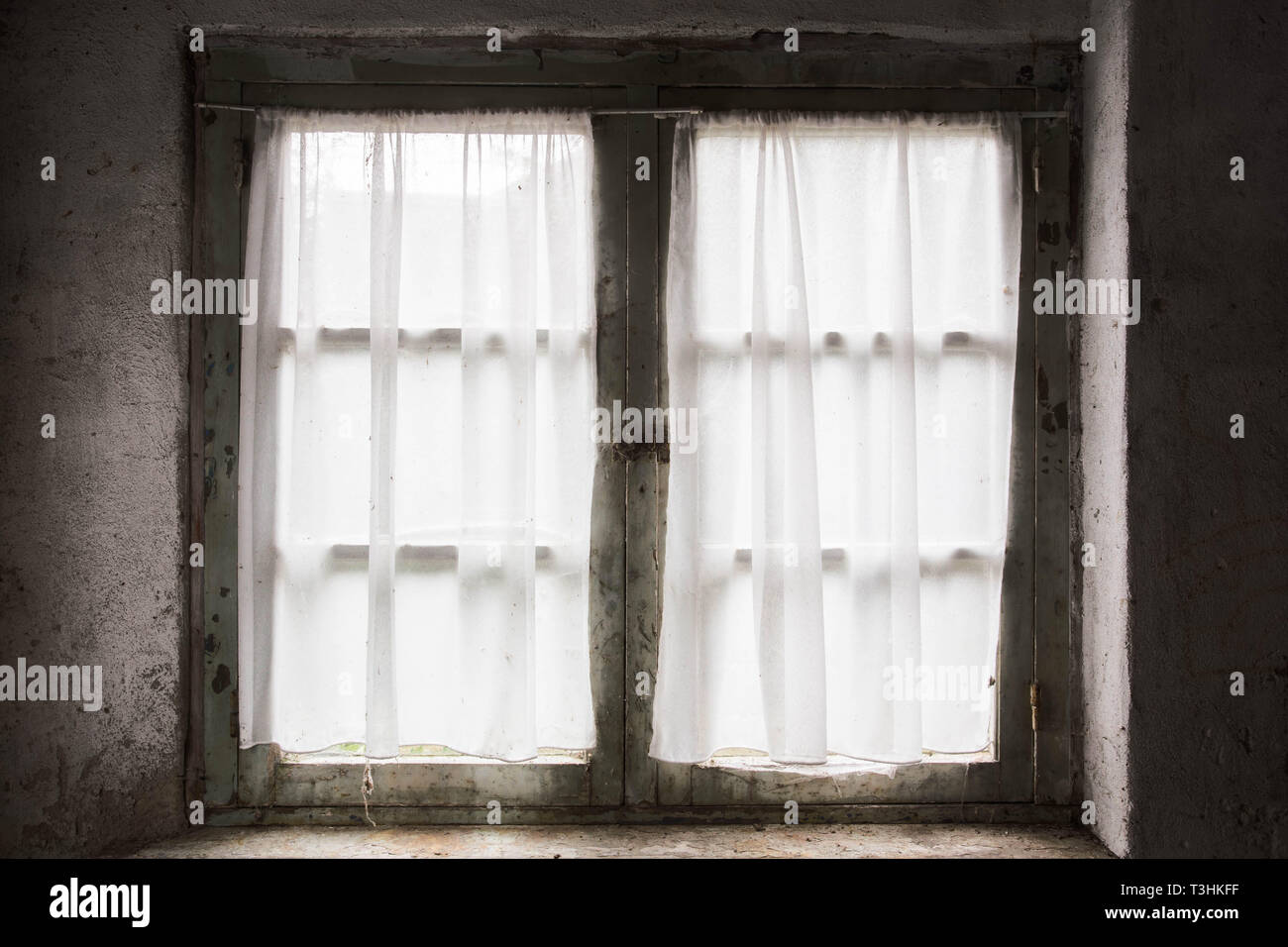 Dark old window with bricks and curtain, light coming through Stock ...