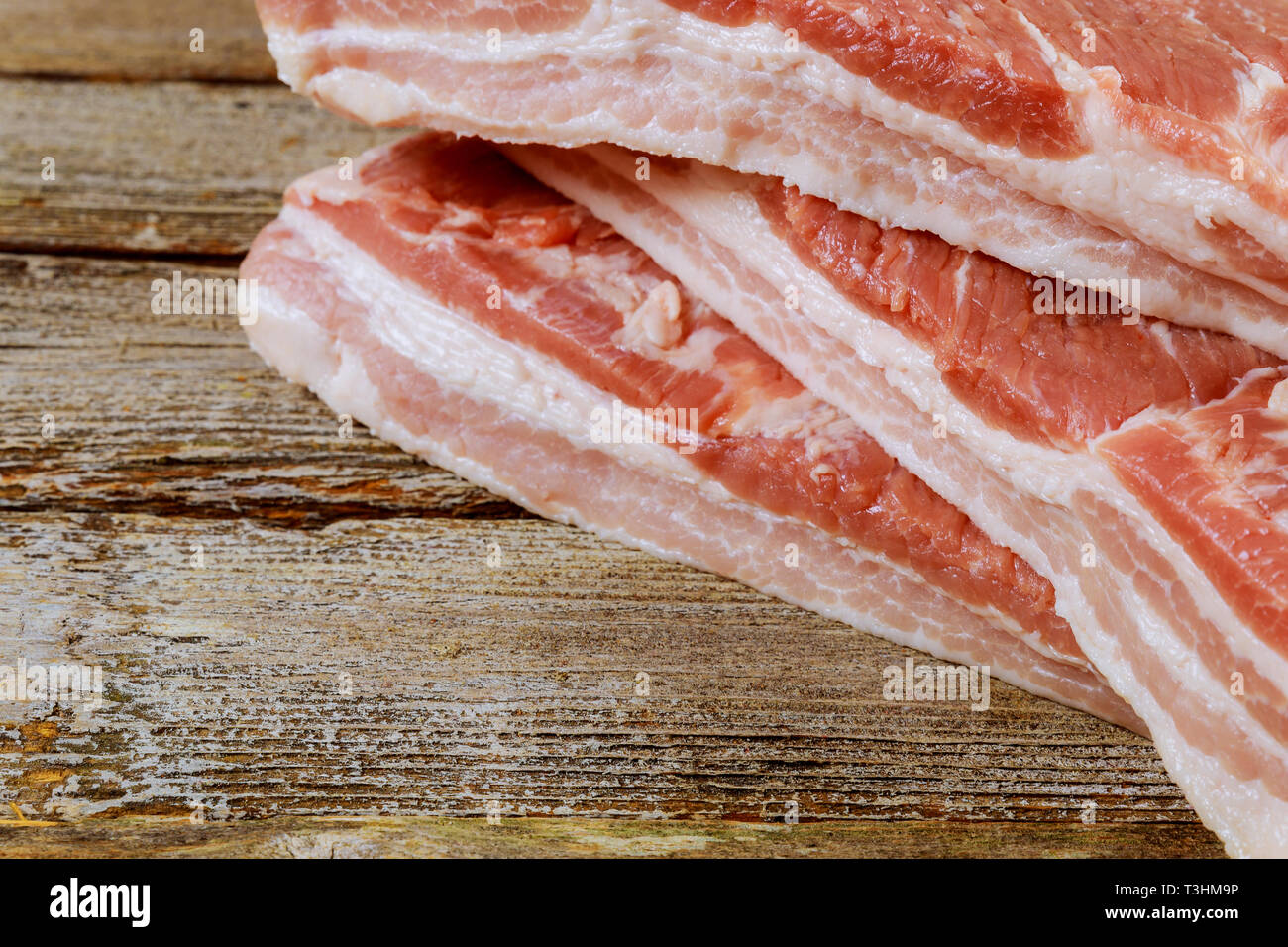 Fresh raw meat pork fresh pork chop bacon rustic wood background Stock ...