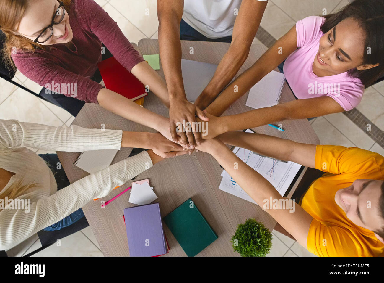 Multiracial hands together hi-res stock photography and images - Alamy
