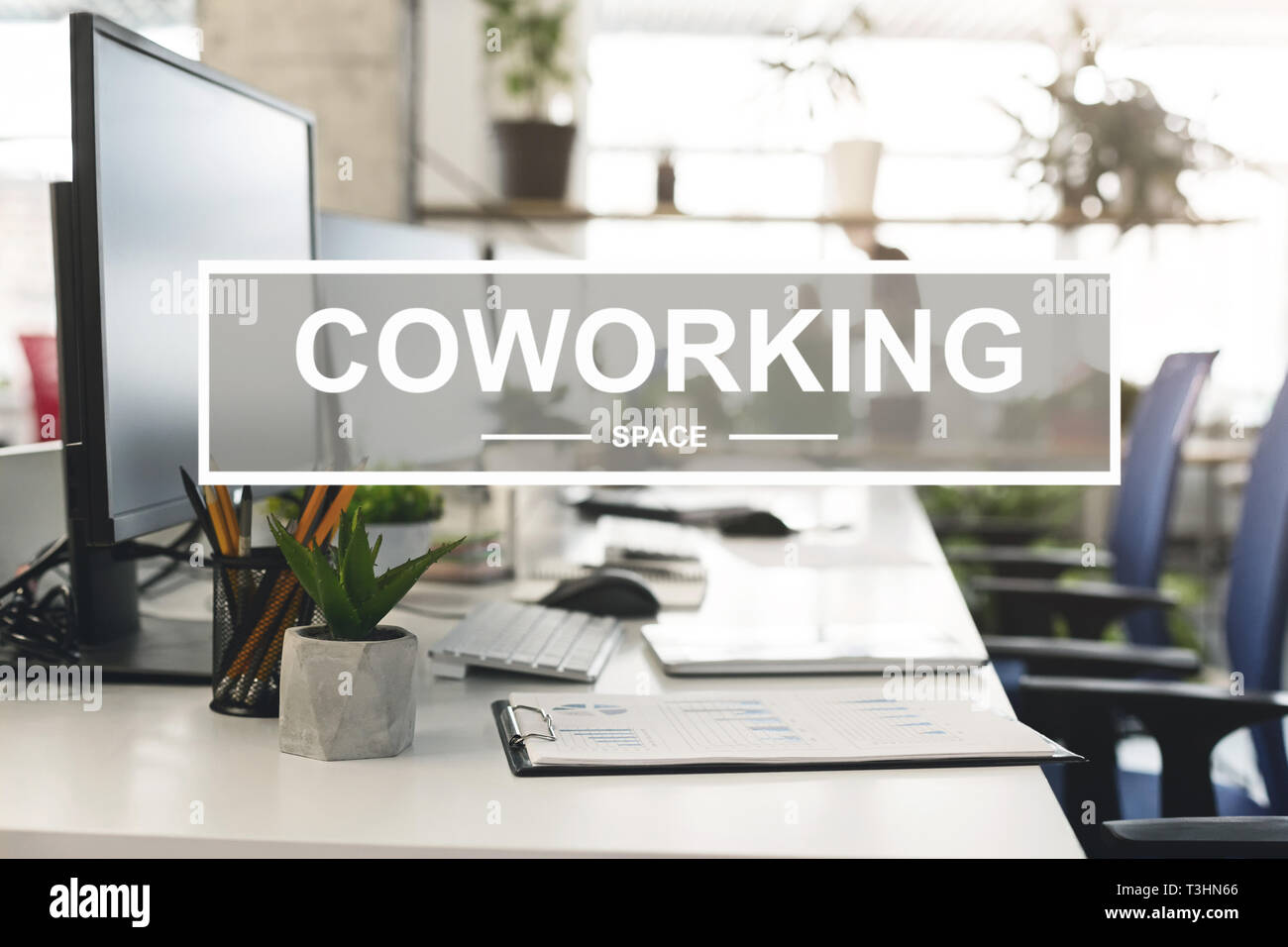 Interior of modern coworking space with computer Stock Photo - Alamy