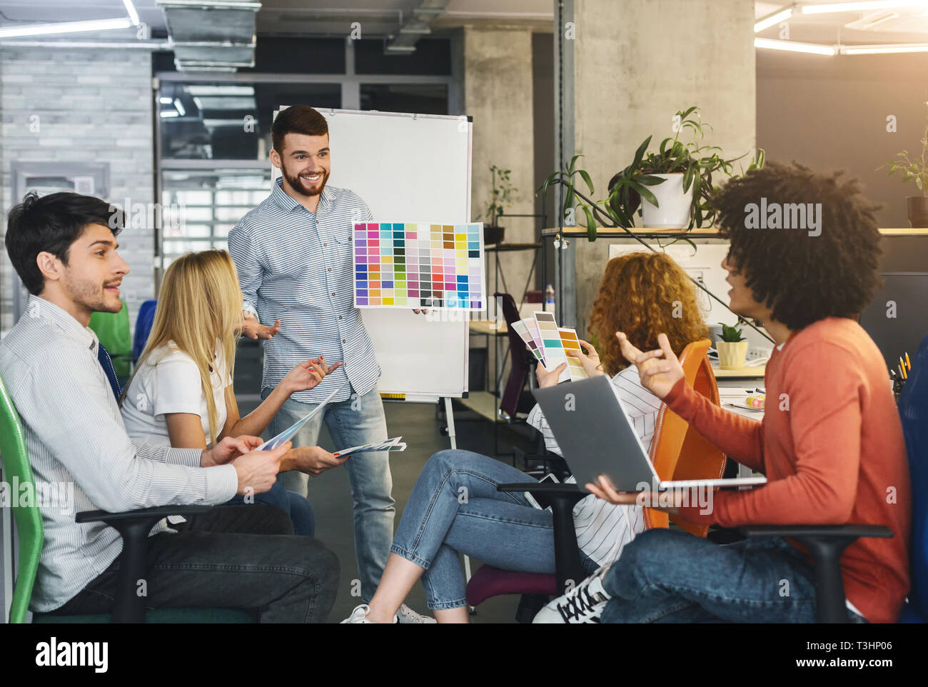 Young creative team choosing color design of new project Stock Photo ...