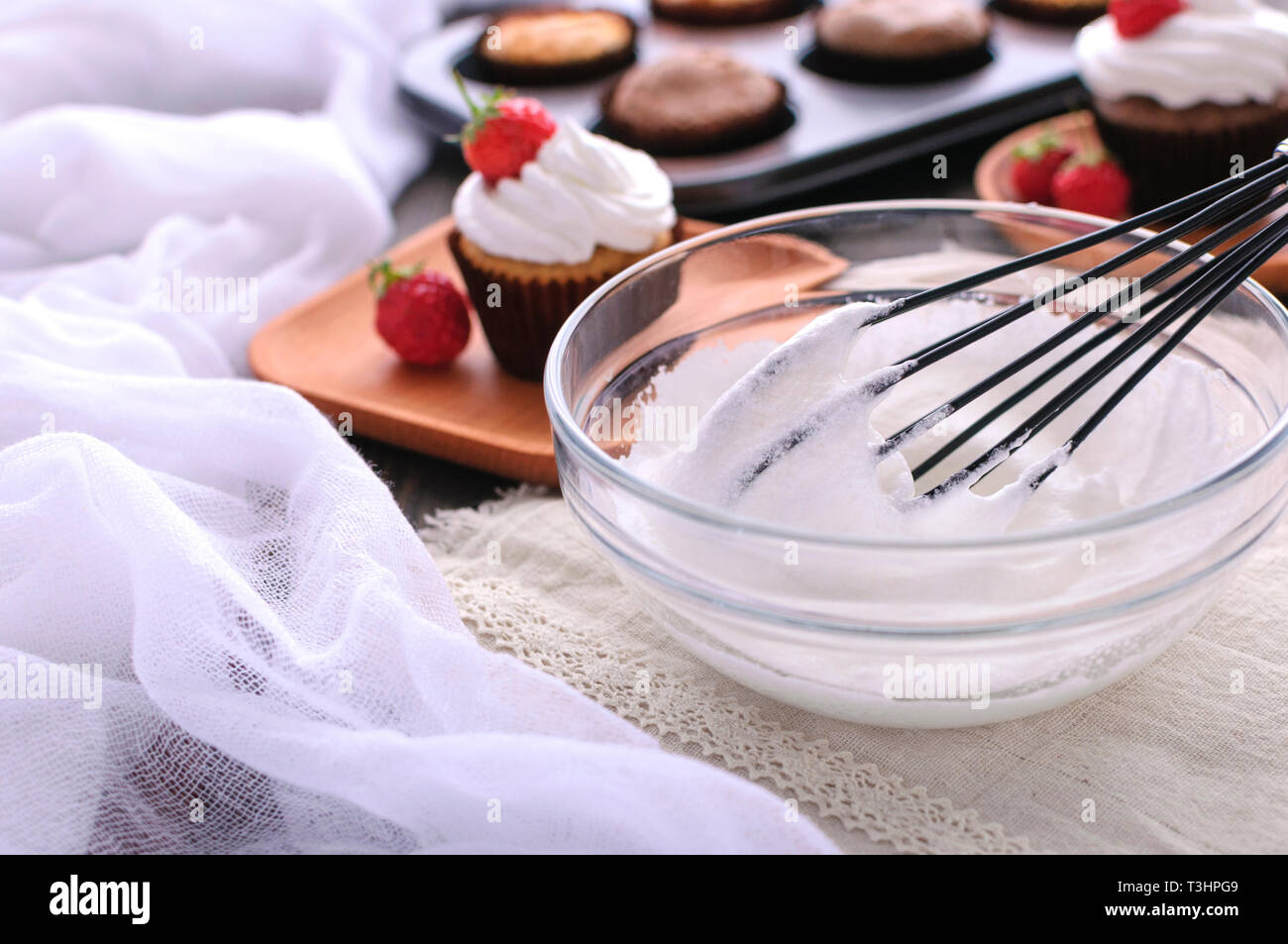 Making a cupcake cream using a whisk Stock Photo - Alamy