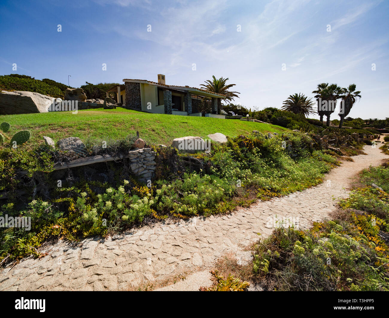 Typical Sardinian landscape with a pedestrian path between the rocks ...