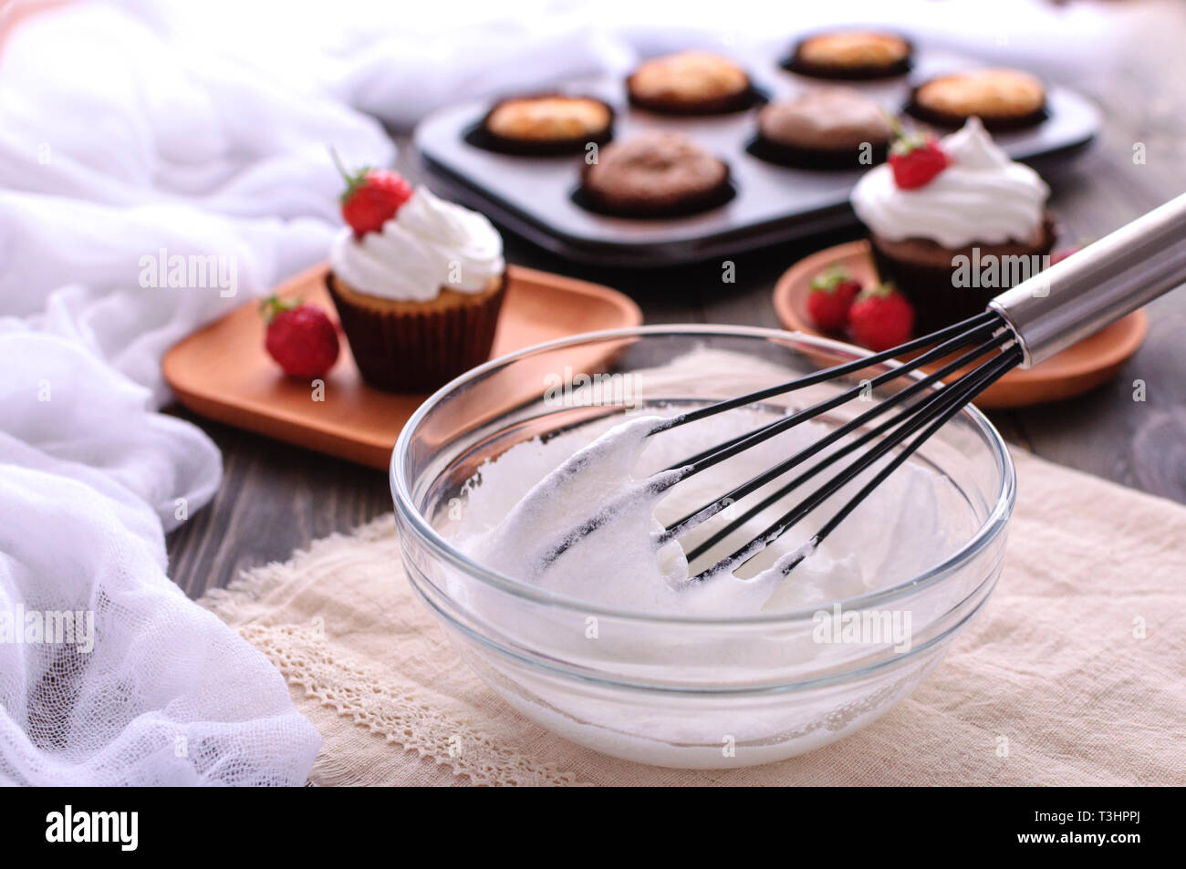 Making a cupcake cream using a whisk Stock Photo - Alamy
