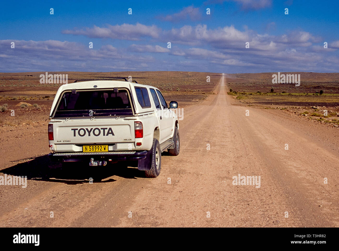 Off-road vehicles on a track in the Namibian desert Stock Photo - Alamy