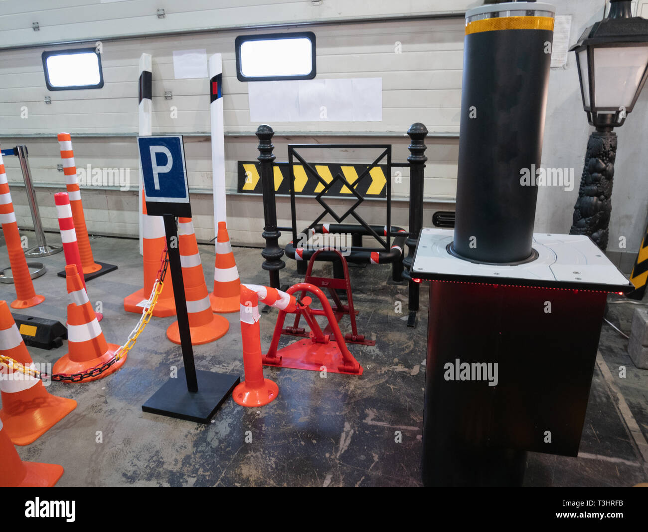 many car traffic road signs and automatic barrier at hardware warehouse ...