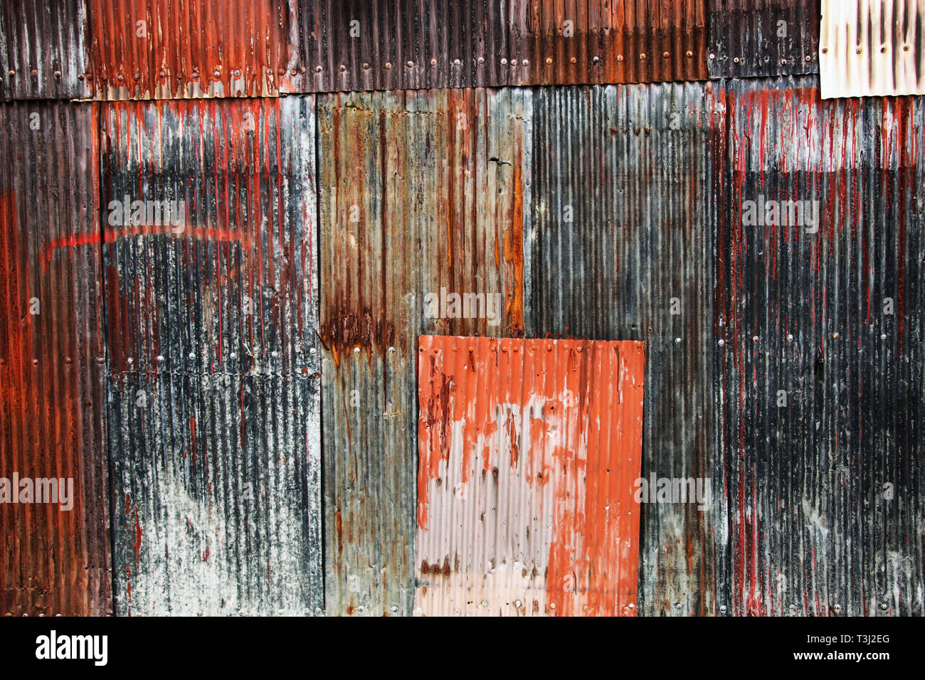 Background image of rusty corrugated metal iron sheets red and blue ...