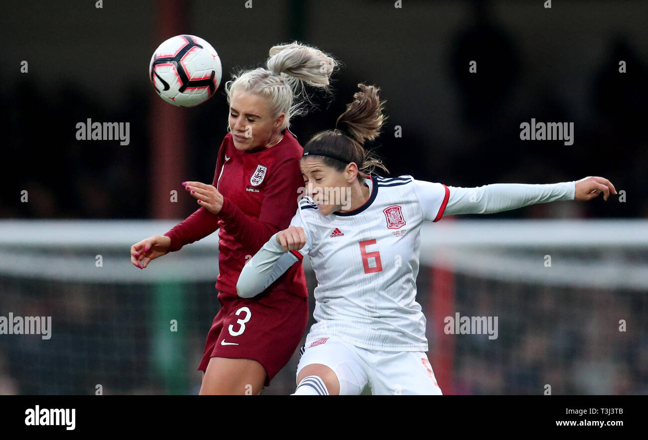 England's Alex Greenwood battles in the air with Spain's Vicky Losada during the International ...