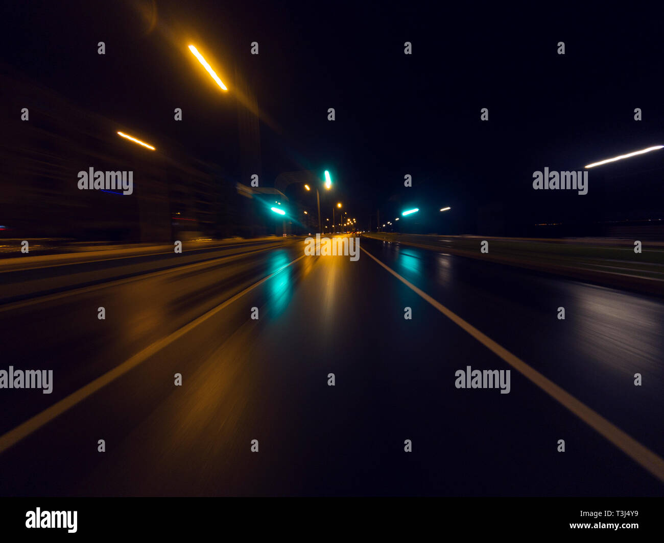 Road from drivers angle at night with green lights Stock Photo - Alamy