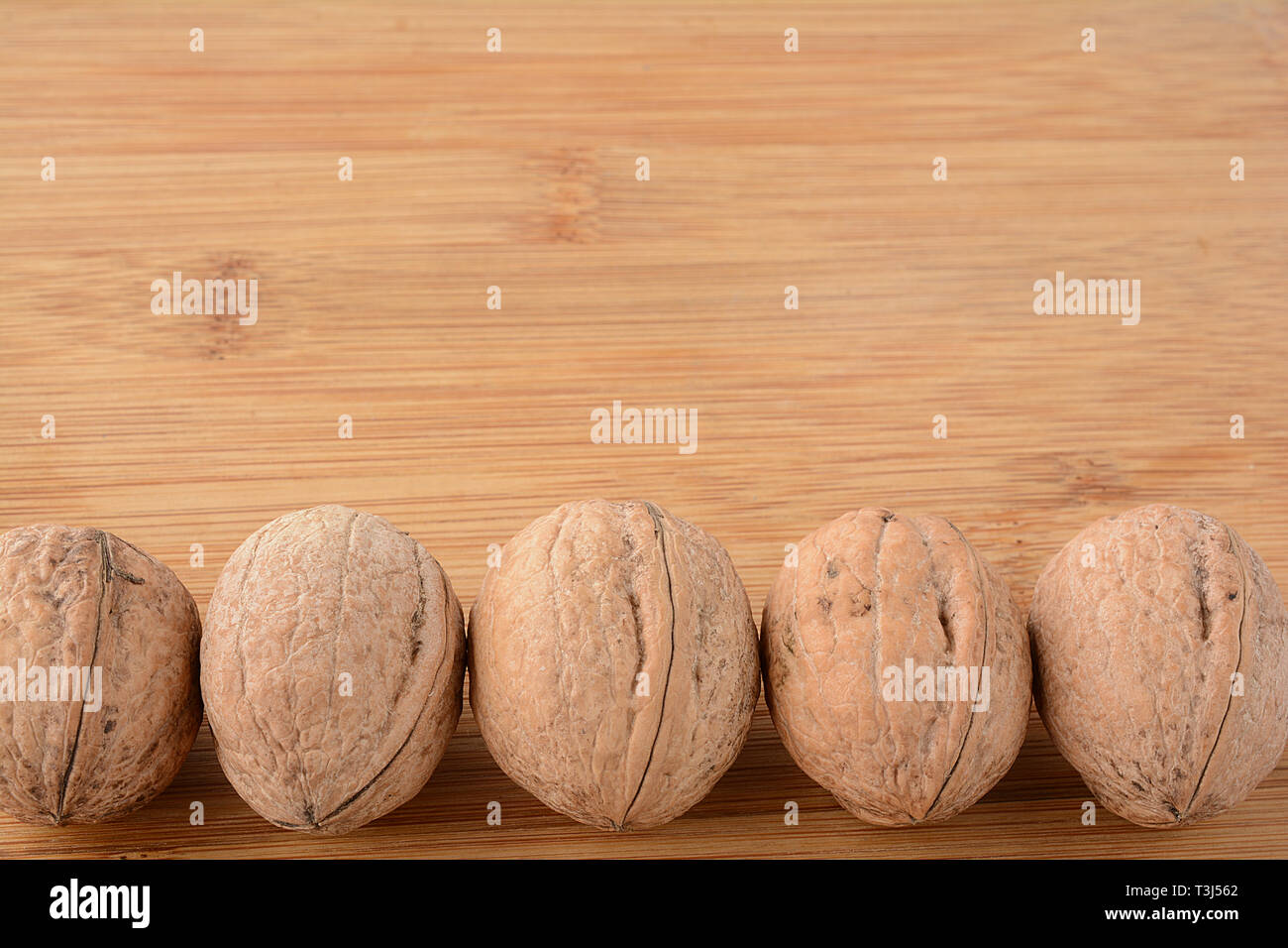 Row of walnuts hi-res stock photography and images - Alamy