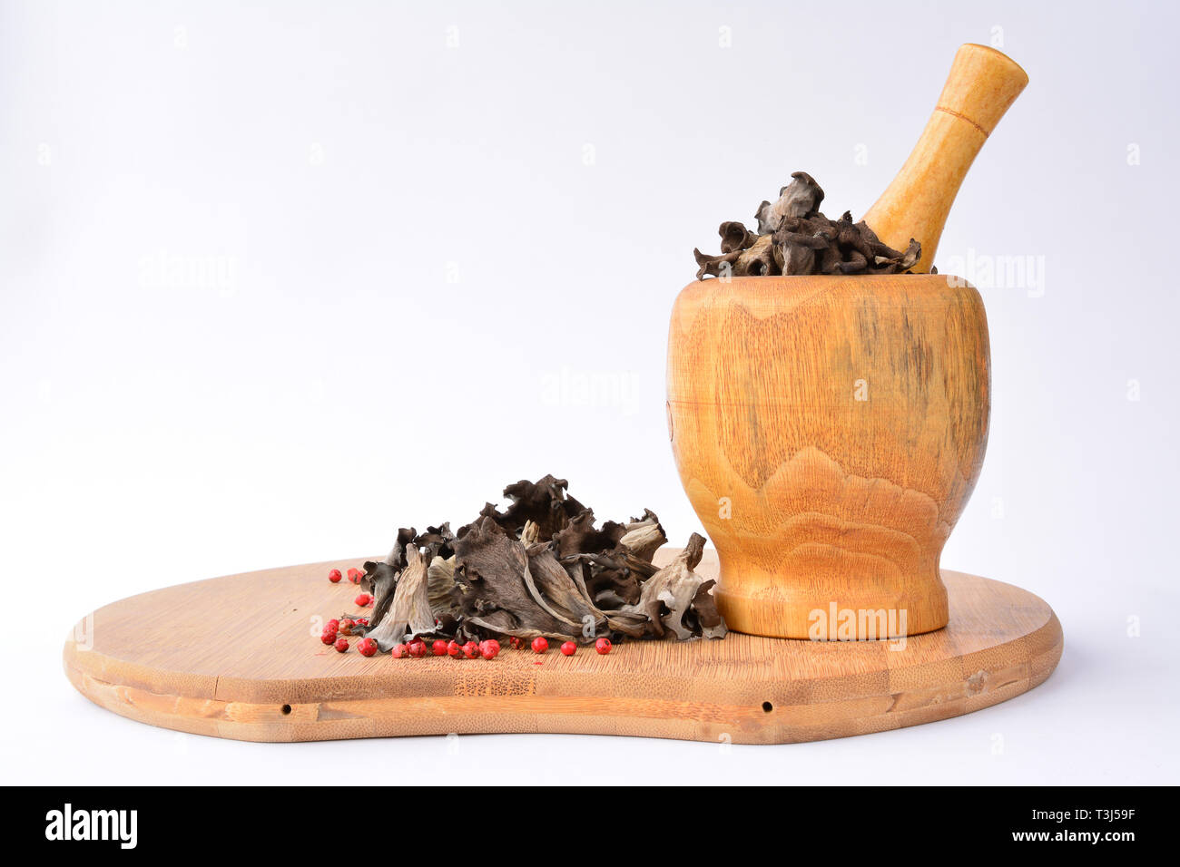 Dried edible, aromatic Horn on plenty mushrooms with red pepper in ...