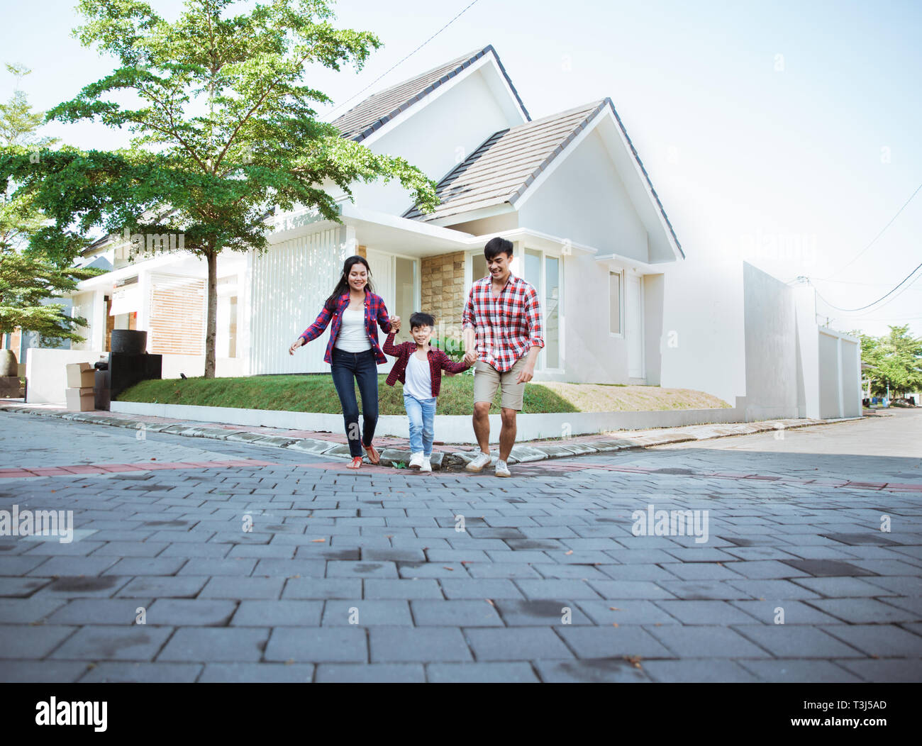 family running around chasing each other Stock Photo - Alamy