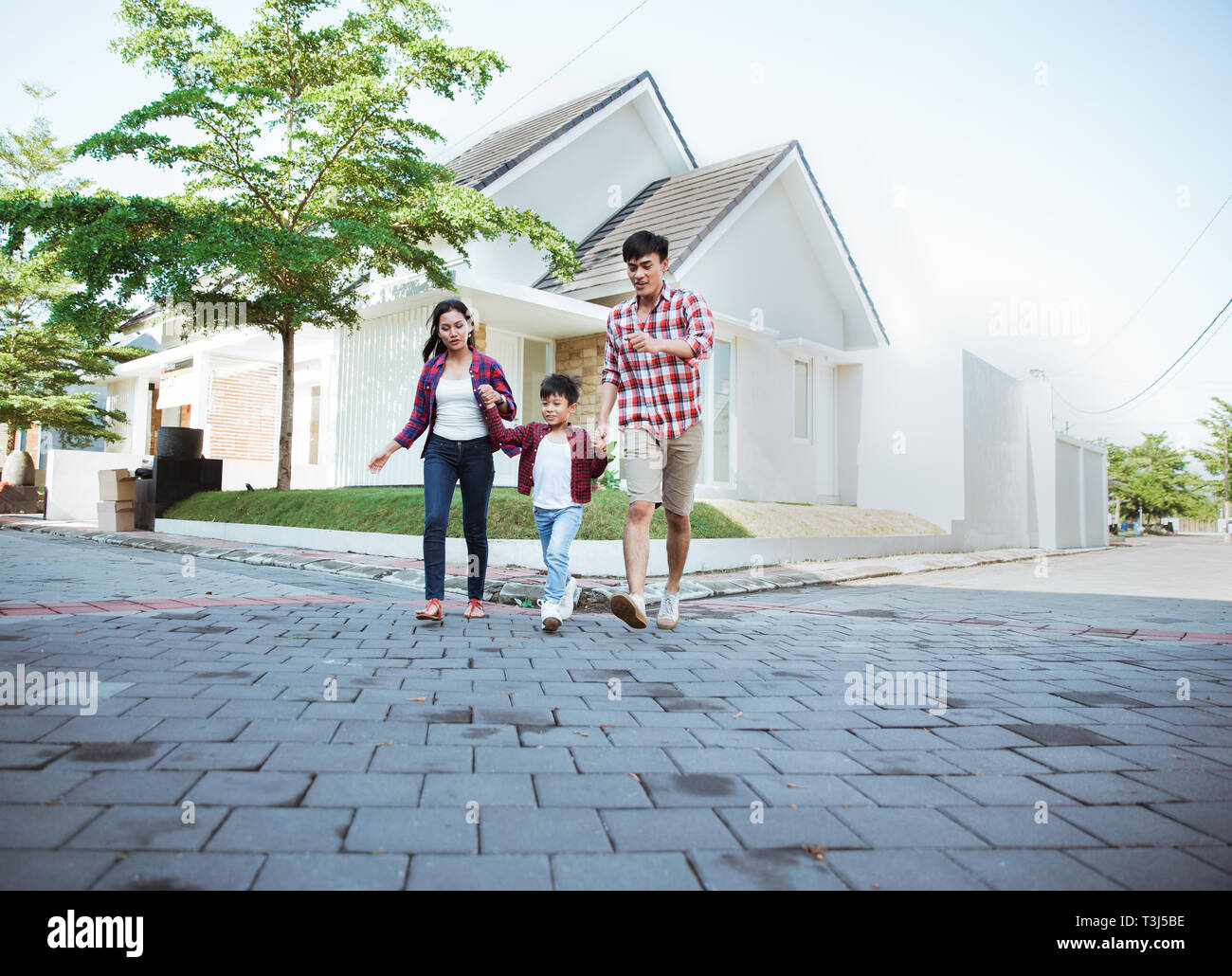 family running around chasing each other Stock Photo - Alamy