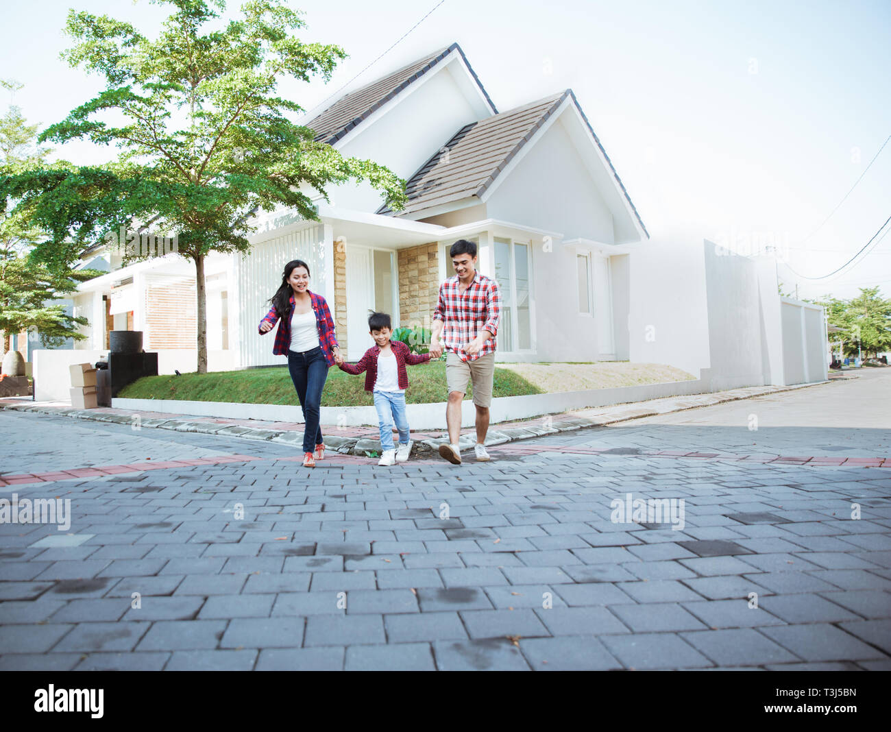 family running around chasing each other Stock Photo - Alamy