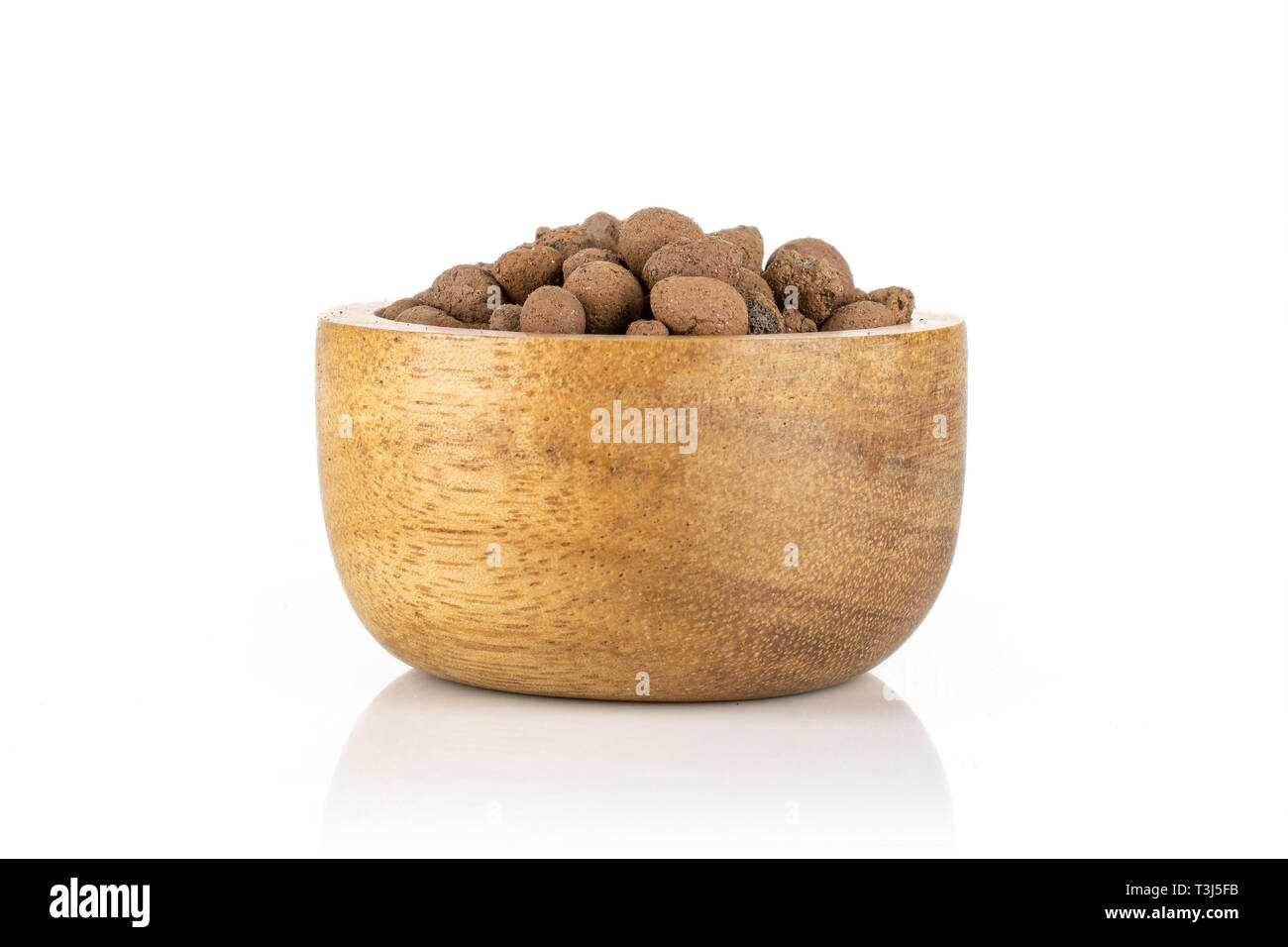 Lot of whole brown clay pebbles (leca) with wooden bowl isolated on ...