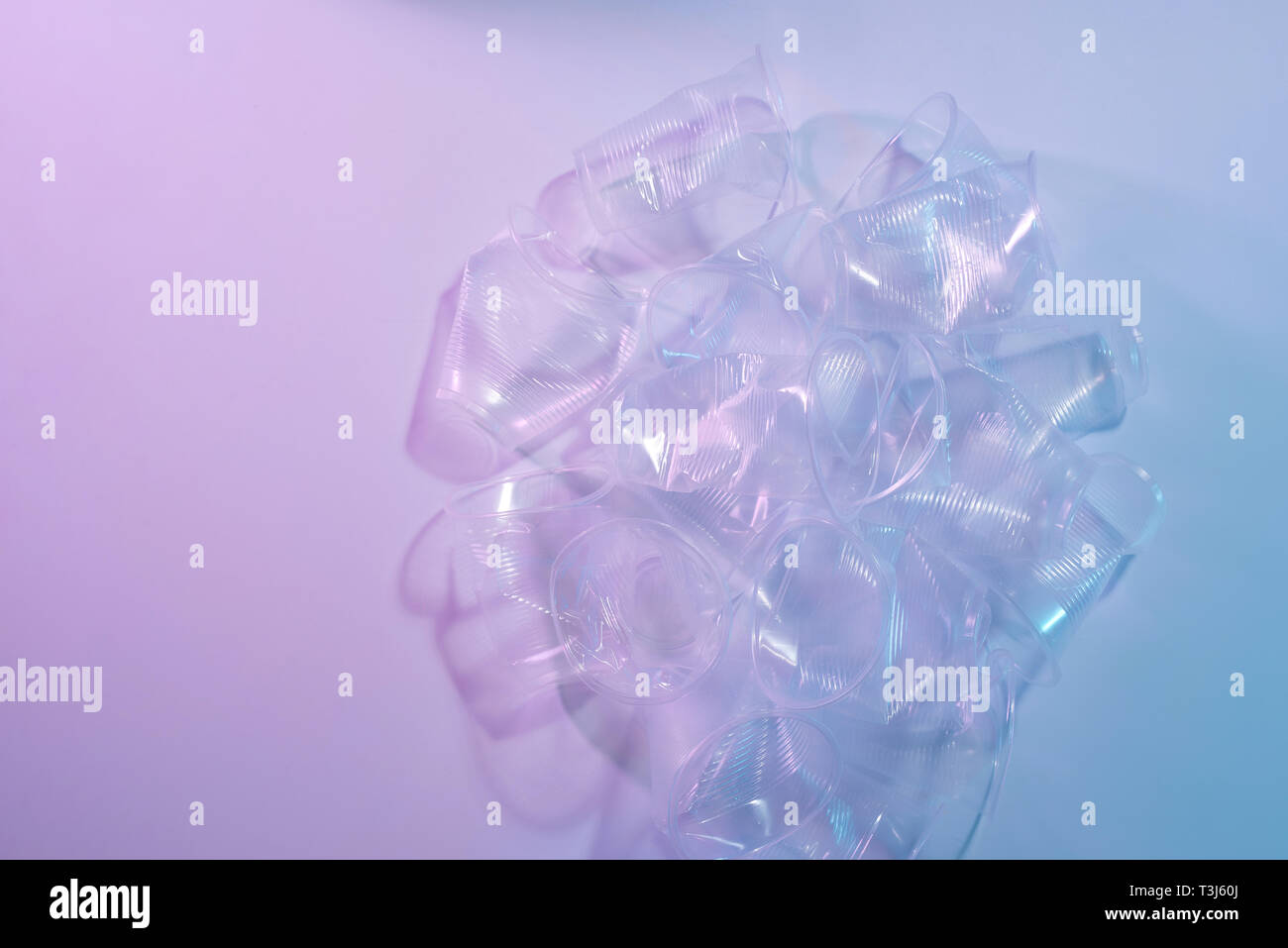 Plastic waste, Plastic cups on light background Stock Photo - Alamy