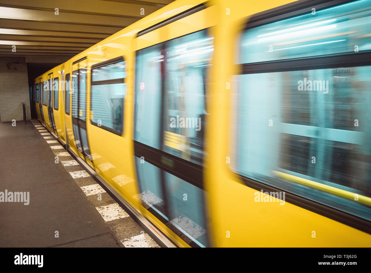 Yellow blurred subway train in Berlin. Public U-bahn transport in ...