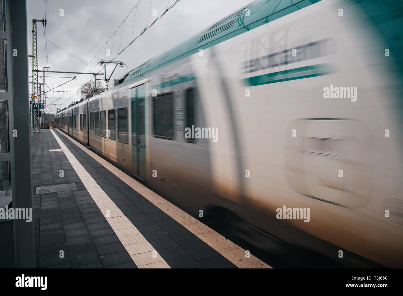 Blurred train motion with high speed at railway station Stock Photo - Alamy
