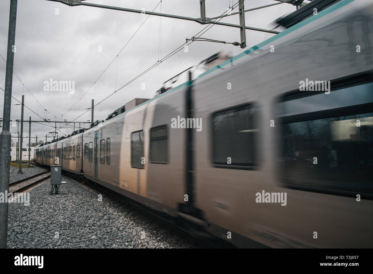 Blurred train motion with high speed at railway station Stock Photo - Alamy