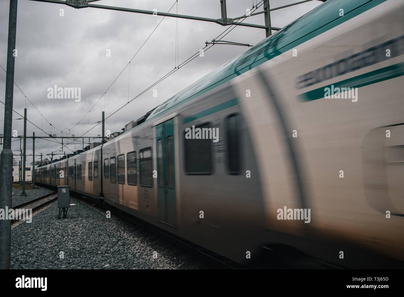 Blurred train motion with high speed at railway station Stock Photo - Alamy