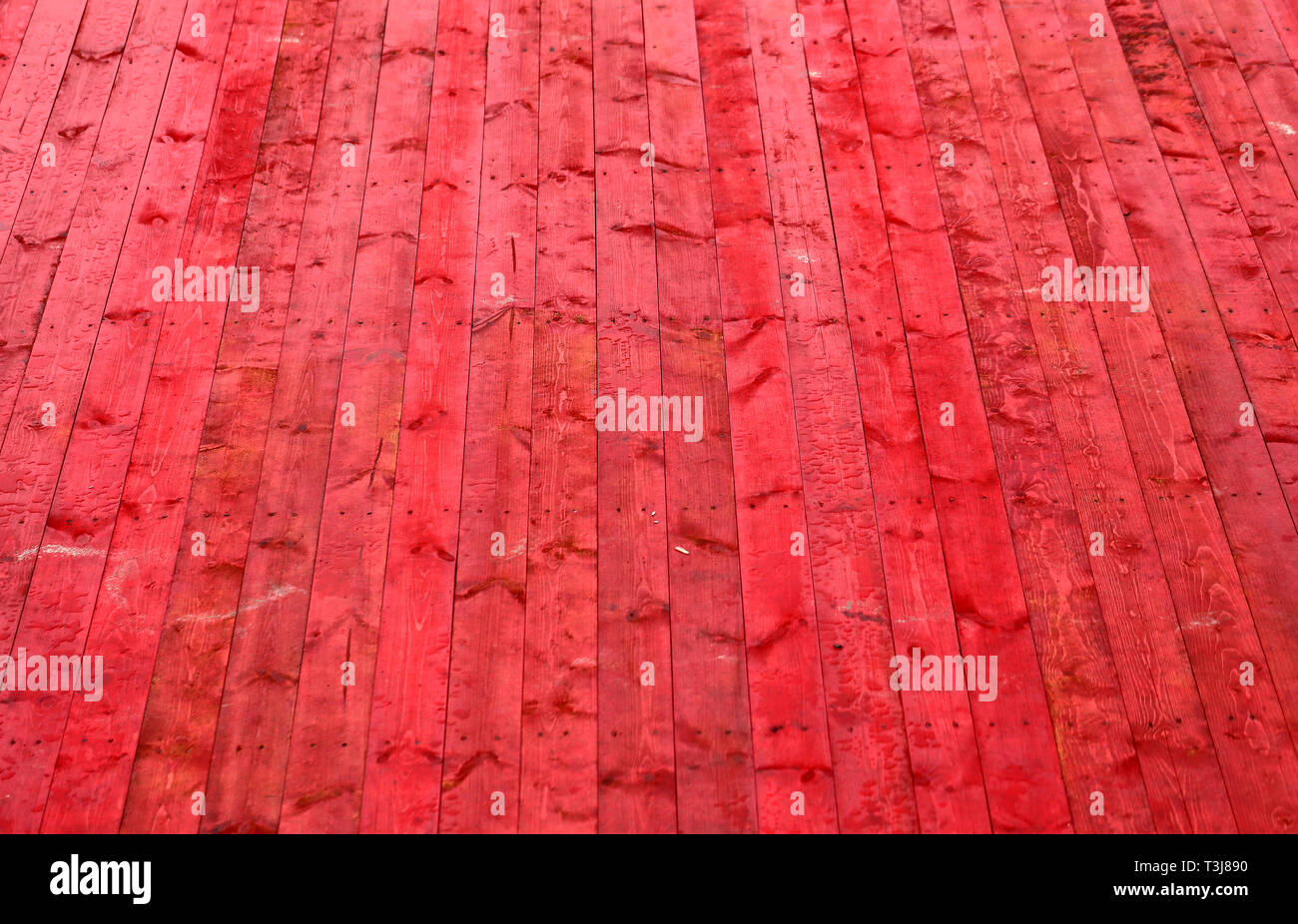 Bright red photo background wooden floor on the street Stock Photo - Alamy