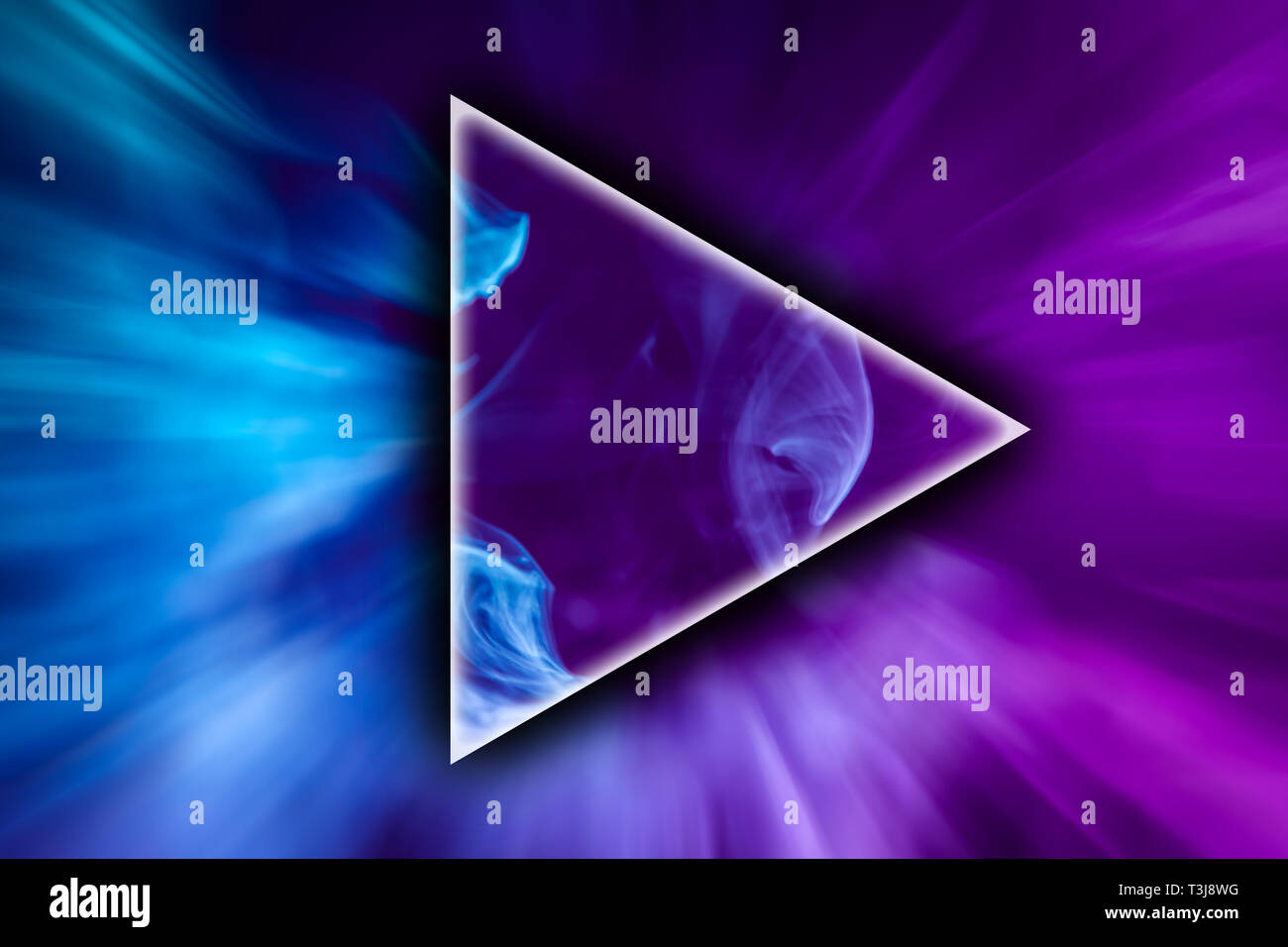 Thick colorful smoke of pink, blue in the shape of a triangle on a ...