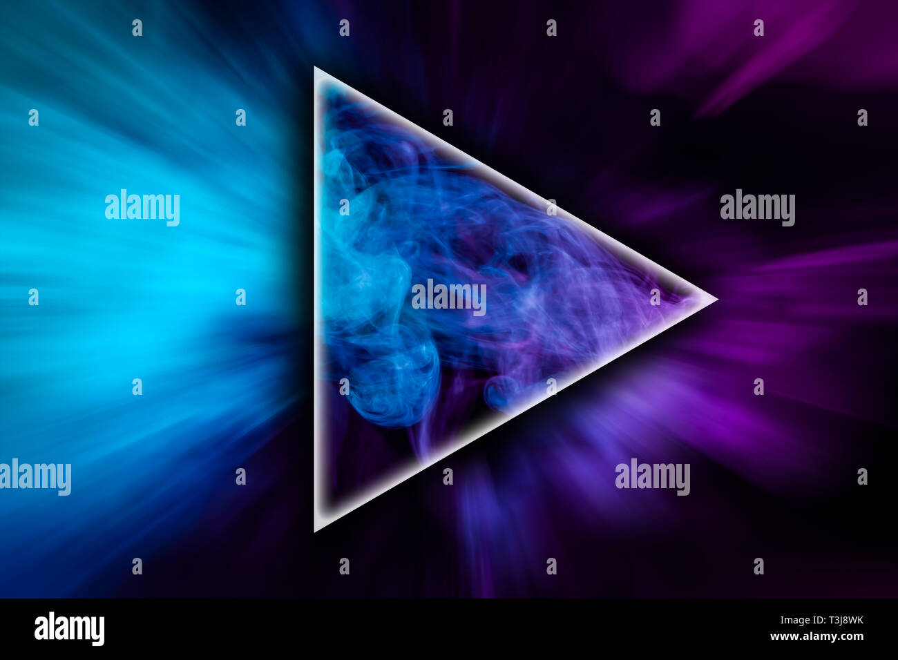 Thick colorful smoke of pink, blue in the shape of a triangle on a ...