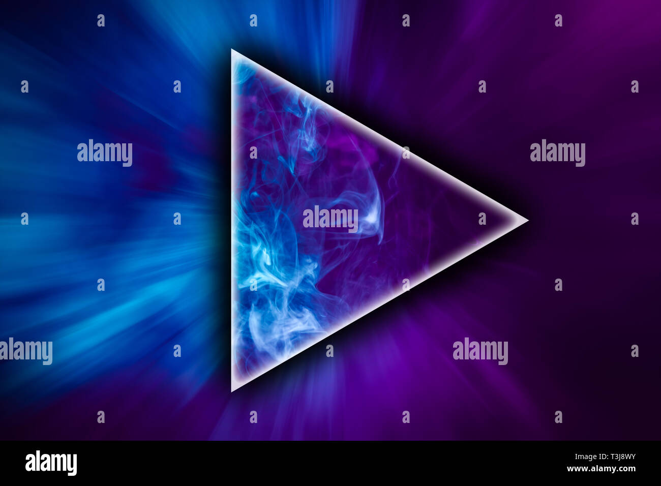 Blue and pink bomb smoke in the shape of a triangle on black isolated ...