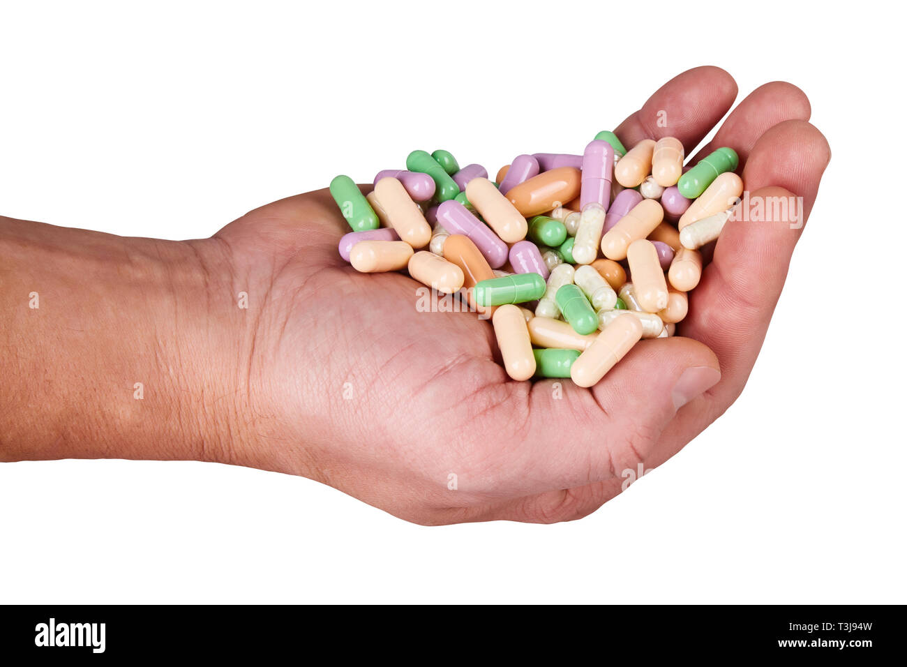 Hand holding vitamin tablets hi-res stock photography and images - Alamy