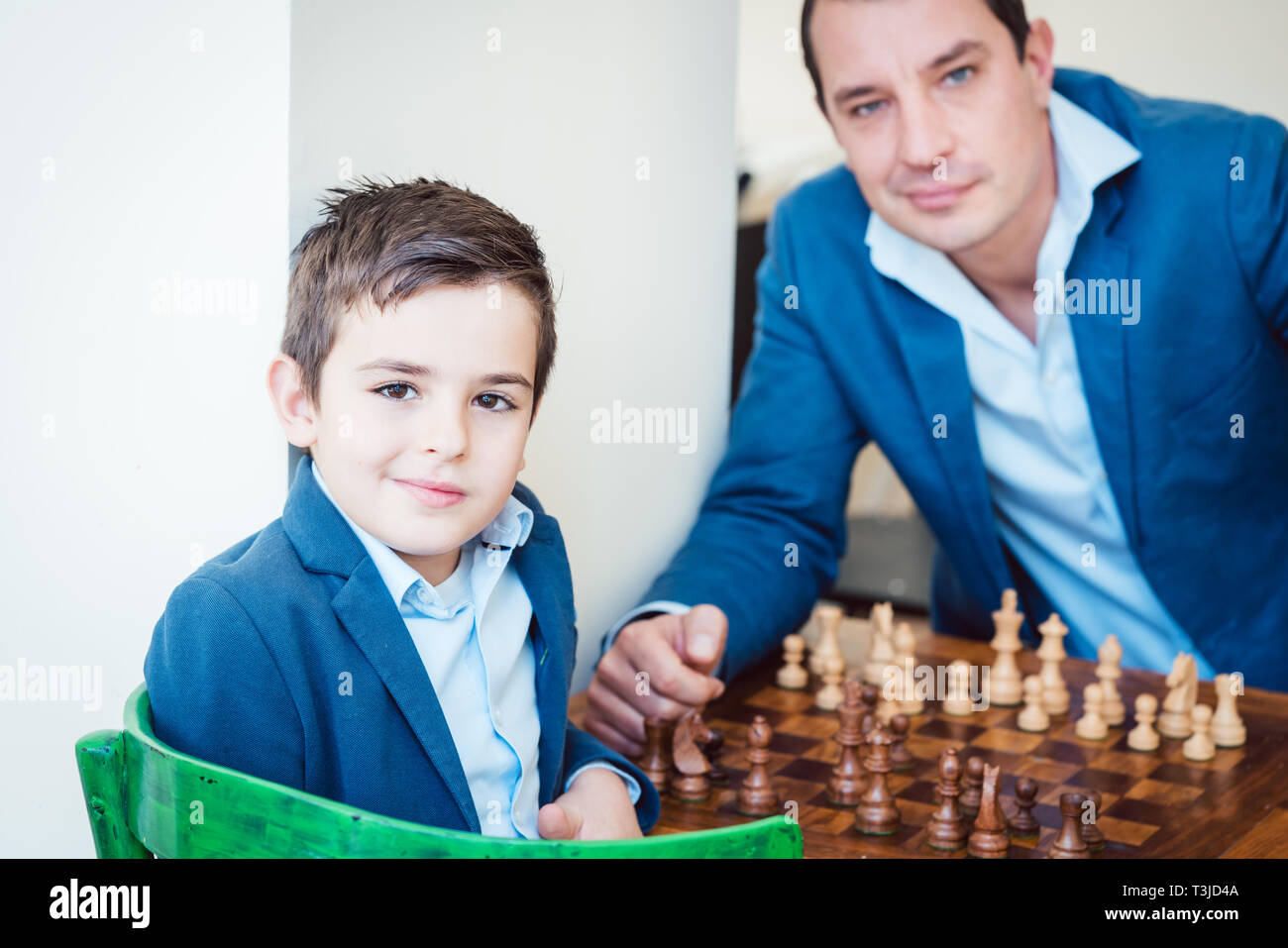 Father and son playing chess Stock Photo - Alamy