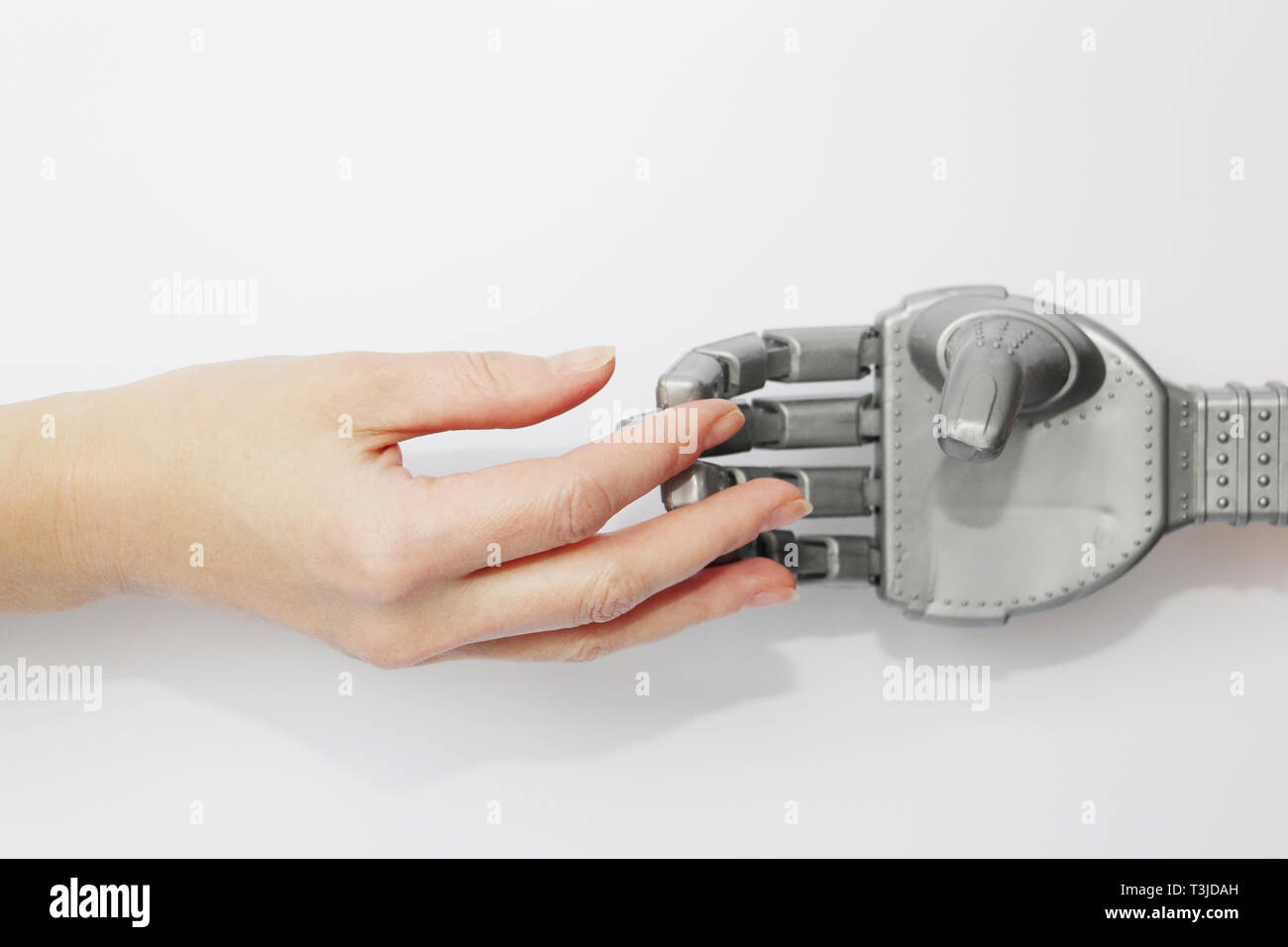 Robot and man. The hand of a living person and the hand of a robot ...