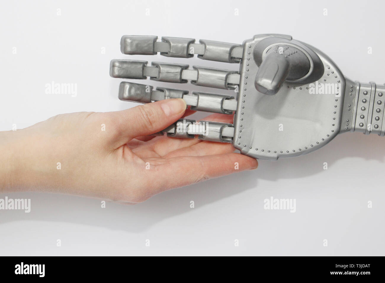Robot and man. The hand of a living person and the hand of a robot ...