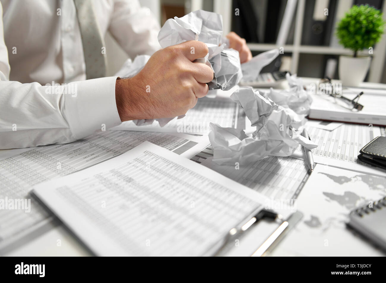 Angry businessman has stress and troubles with bad reports, he breaks ...