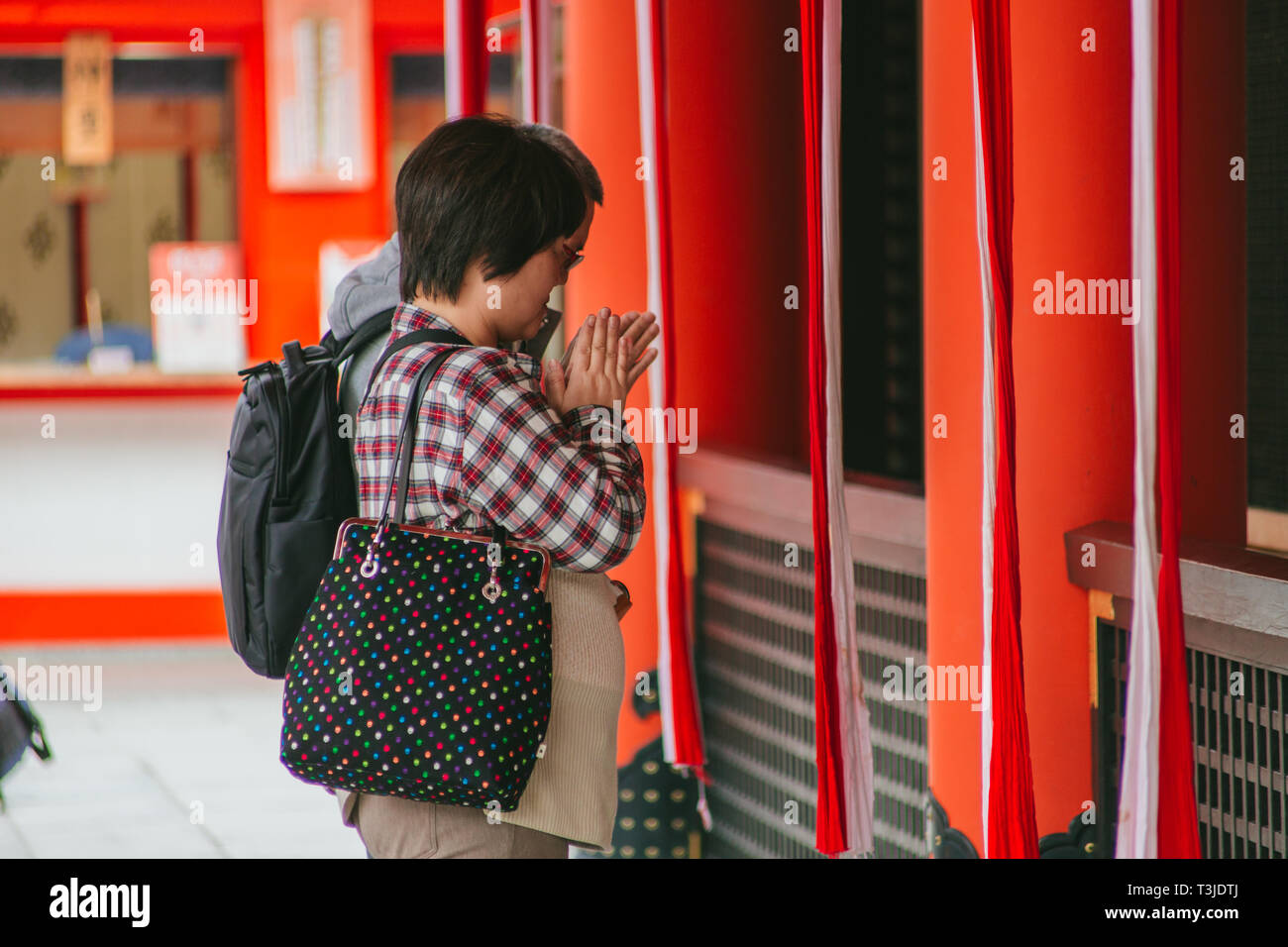 People pay homage throw coins and shake the bell to sacred blessings in ...