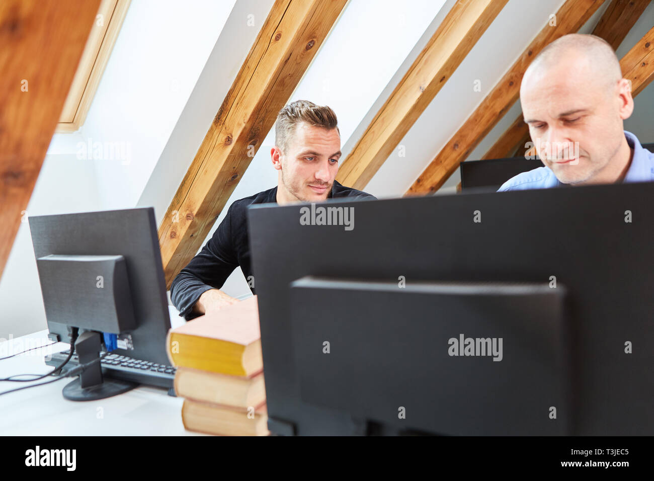 Office man computer colleagues hi-res stock photography and images - Alamy